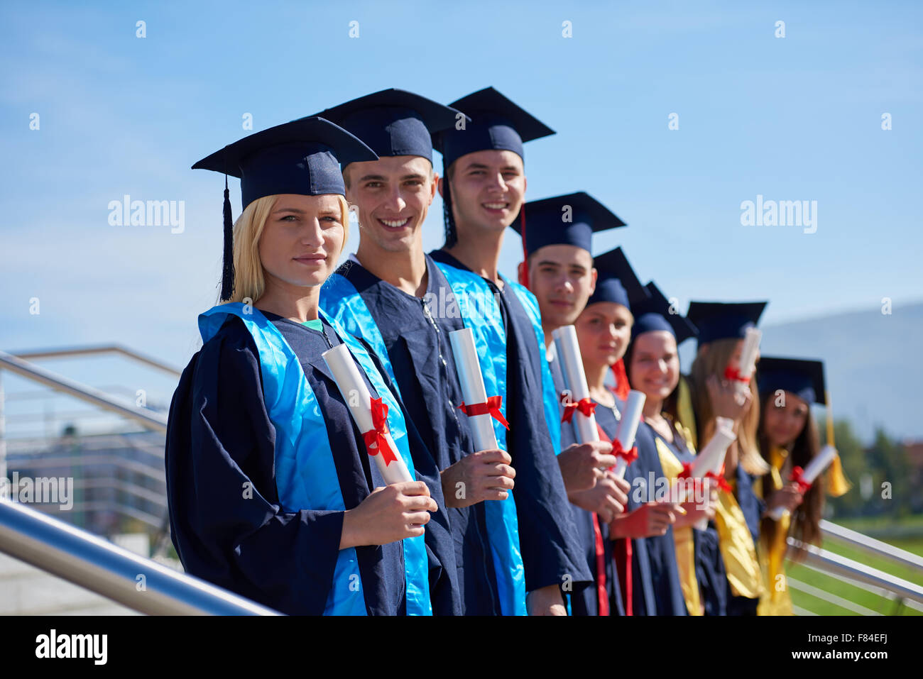 young graduates students group standing in front of university building ...