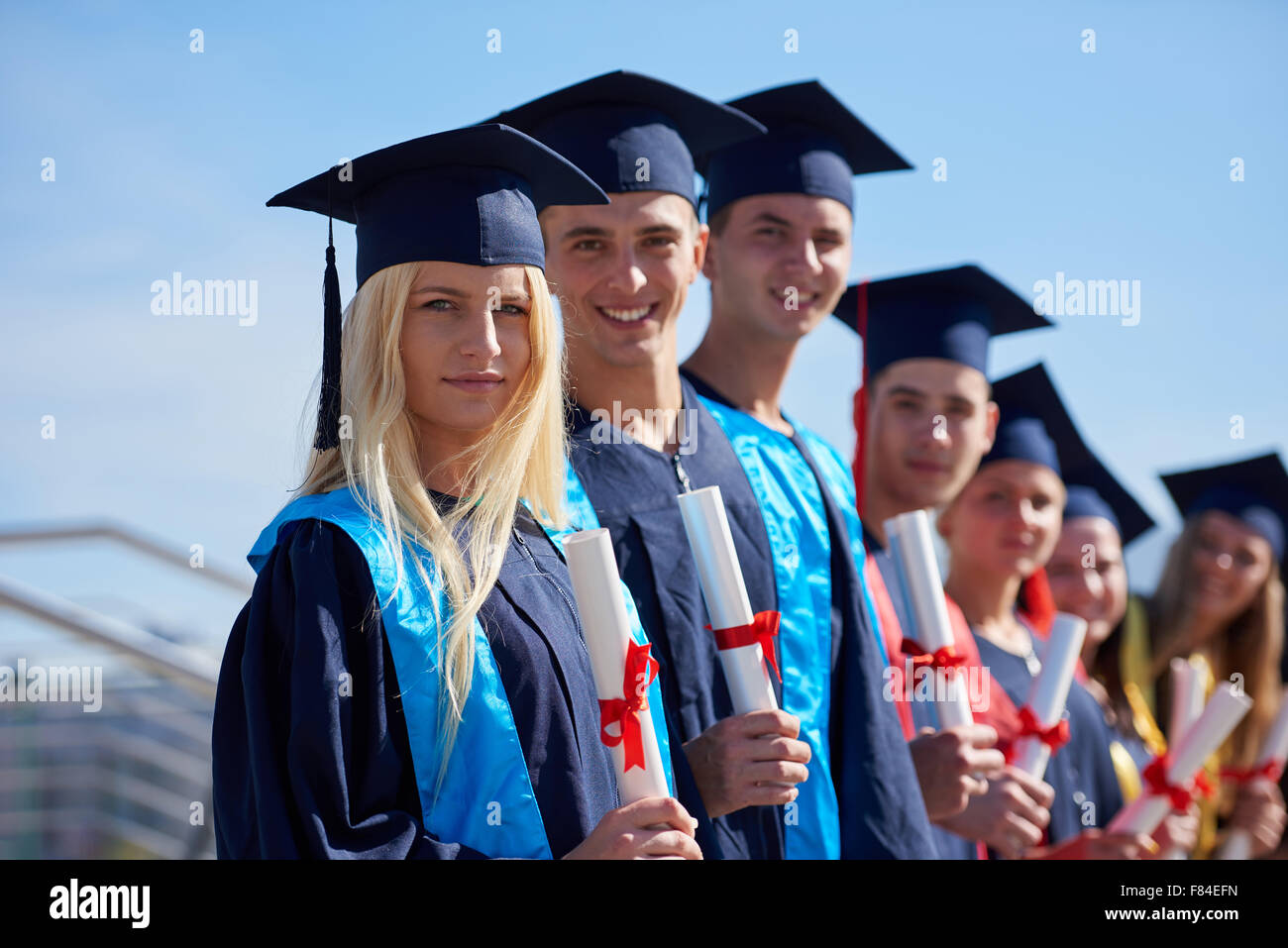 young graduates students group standing in front of university building ...