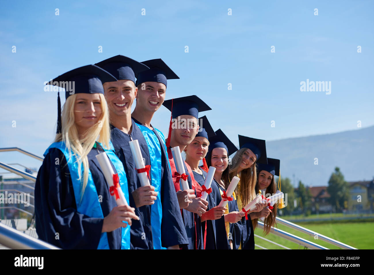 young graduates students group standing in front of university building ...