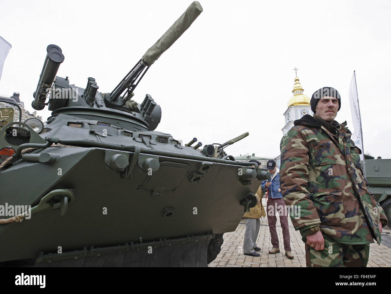 Kiev, Ukraine. 05th Dec, 2015. Ukrainian serviceman stand near the BTR ...