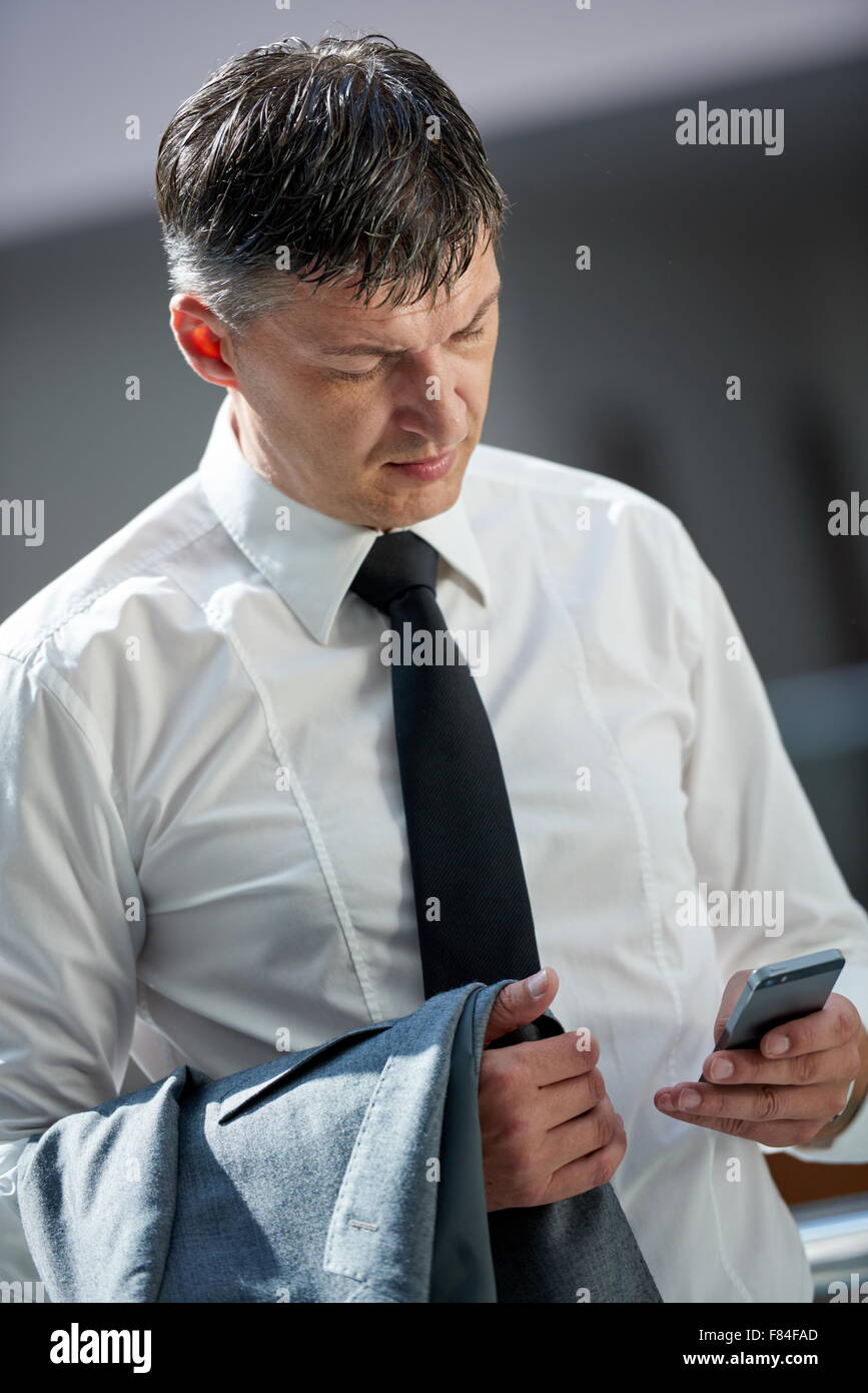 business man using phone at modern office space Stock Photo - Alamy