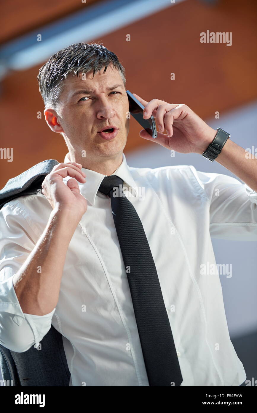 business man using phone at modern office space Stock Photo - Alamy