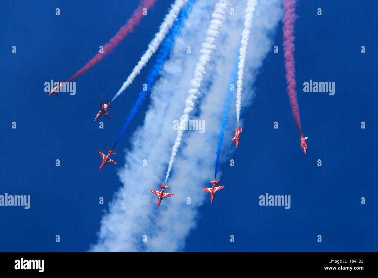 The Red Arrows diving with smoke trails a Southport air show Stock ...