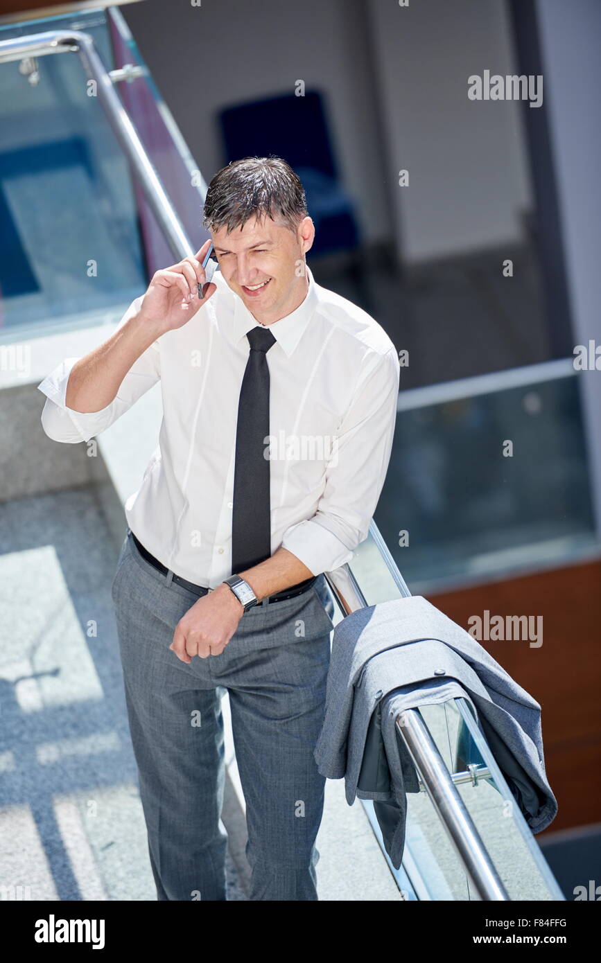 business man using phone at modern office space Stock Photo - Alamy