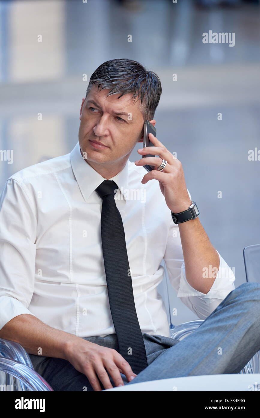 business man using phone at modern office space Stock Photo - Alamy