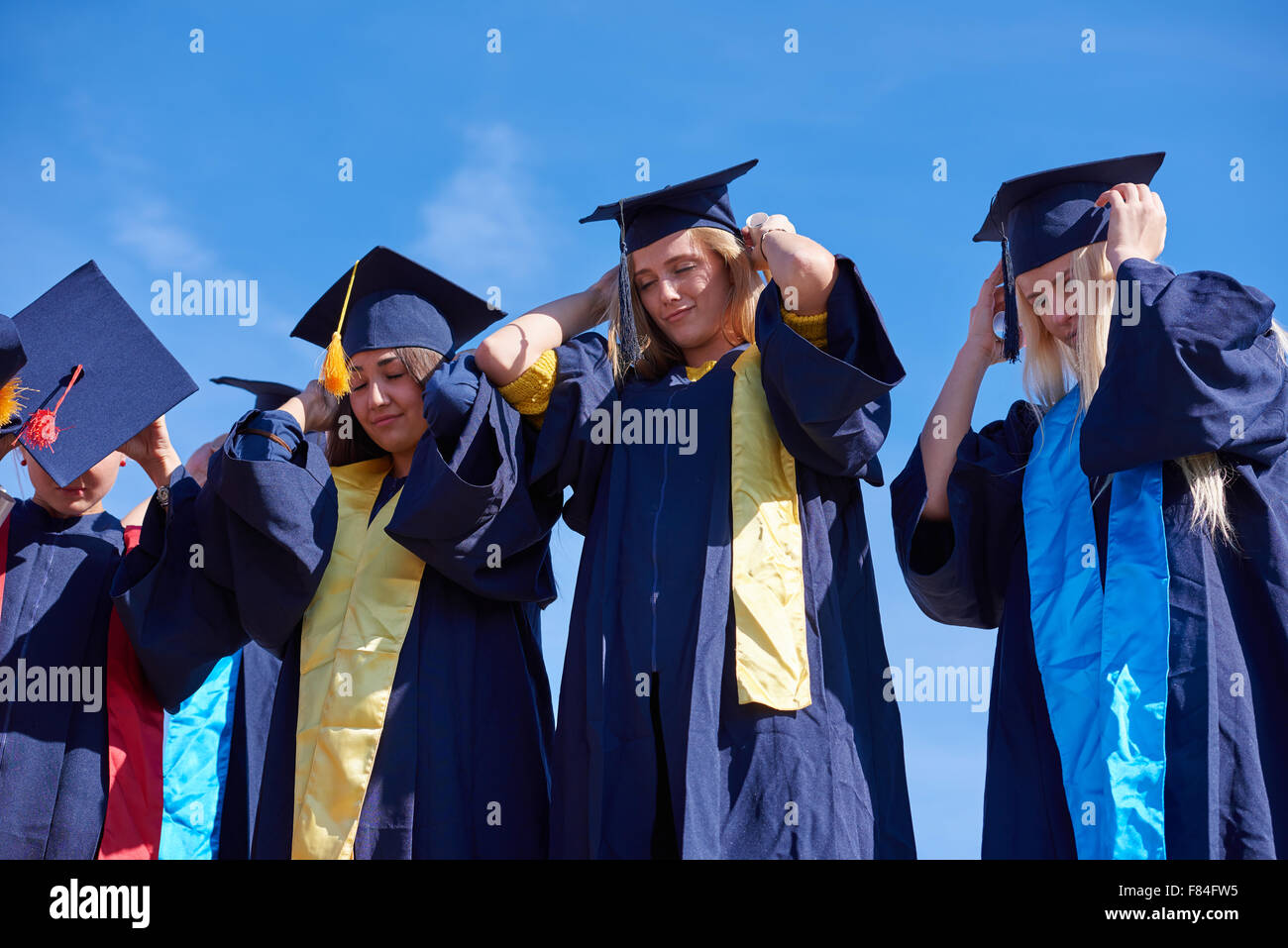 young graduates students group standing in front of university building ...