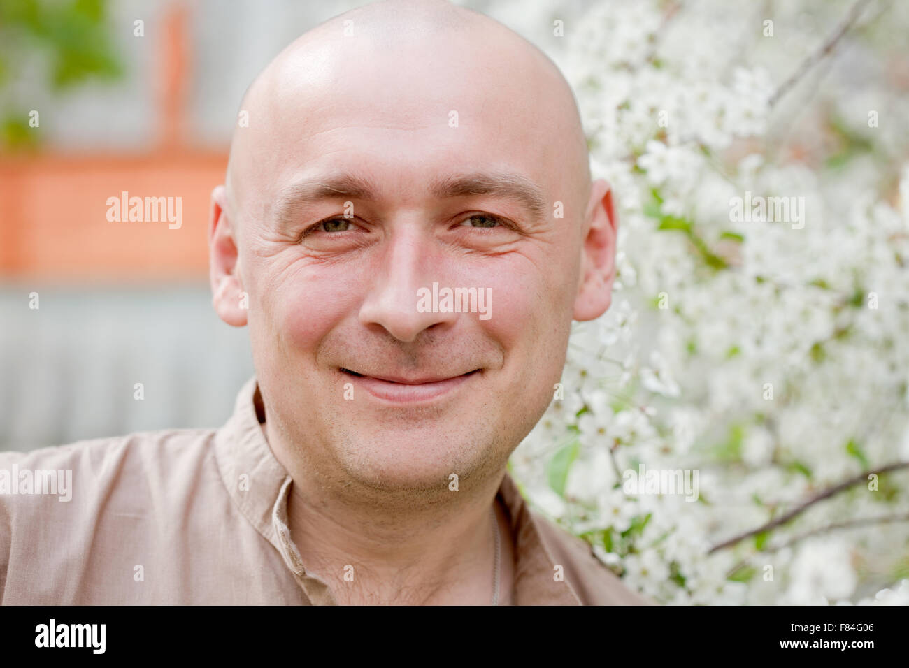 Smiling guy in spring garden Stock Photo - Alamy