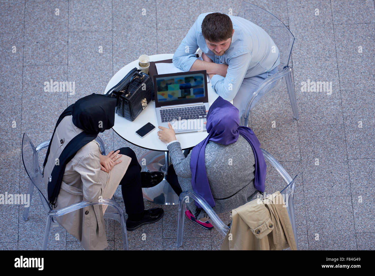 top view, group of students together at school table working homework ...