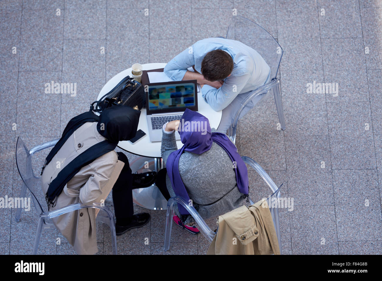 top view, group of students together at school table working homework ...