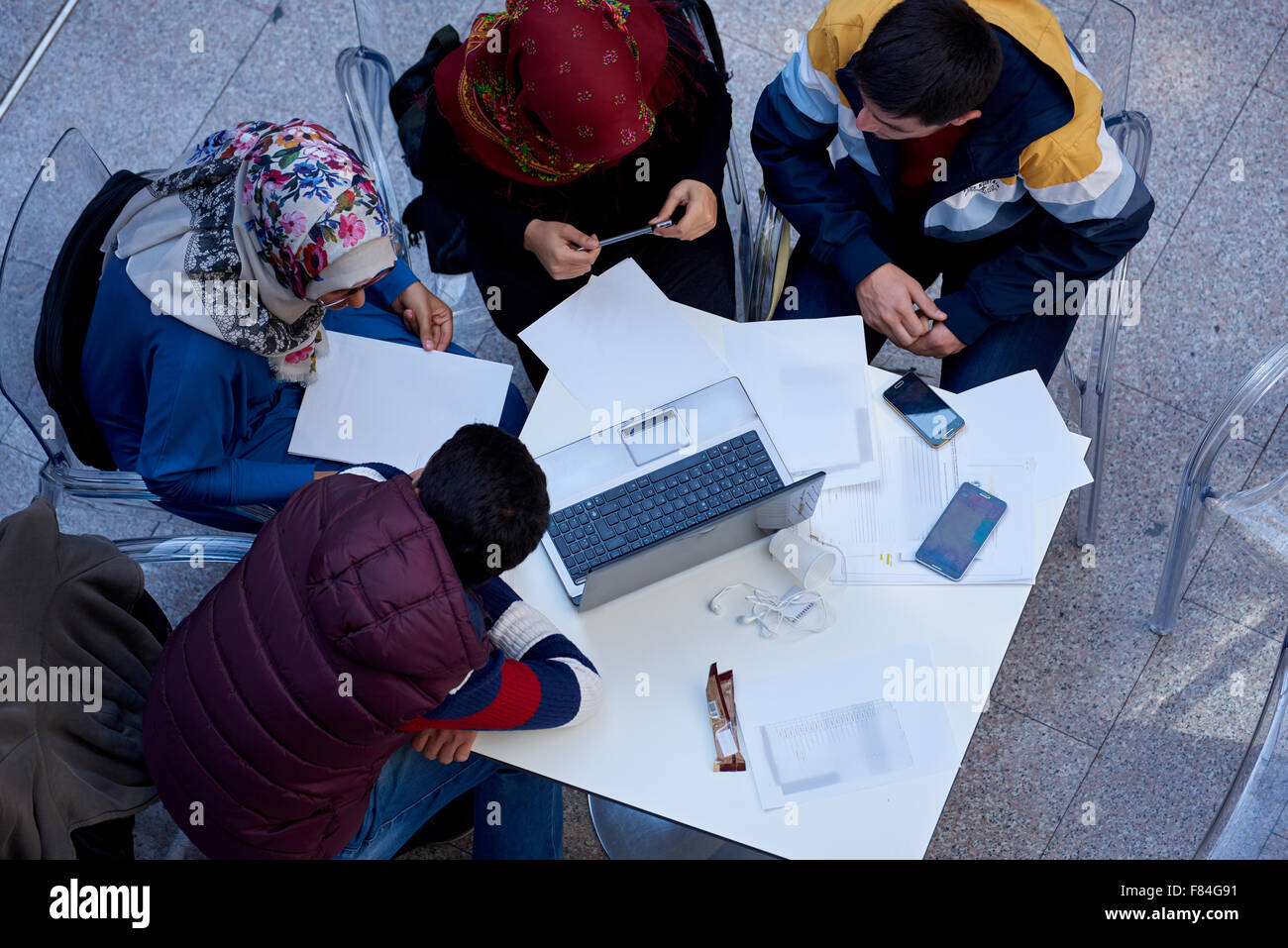 top view, group of students together at school table working homework ...