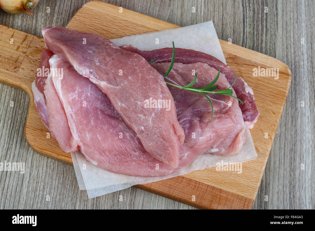 Raw pork Schnitzel with rosemary ready for cooking Stock Photo - Alamy