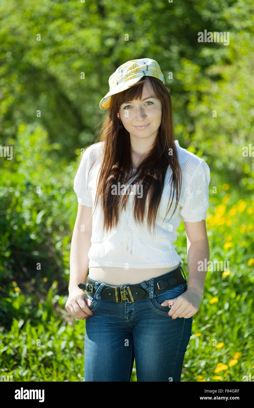Outdoor portrait of smiling girl in cap Stock Photo - Alamy