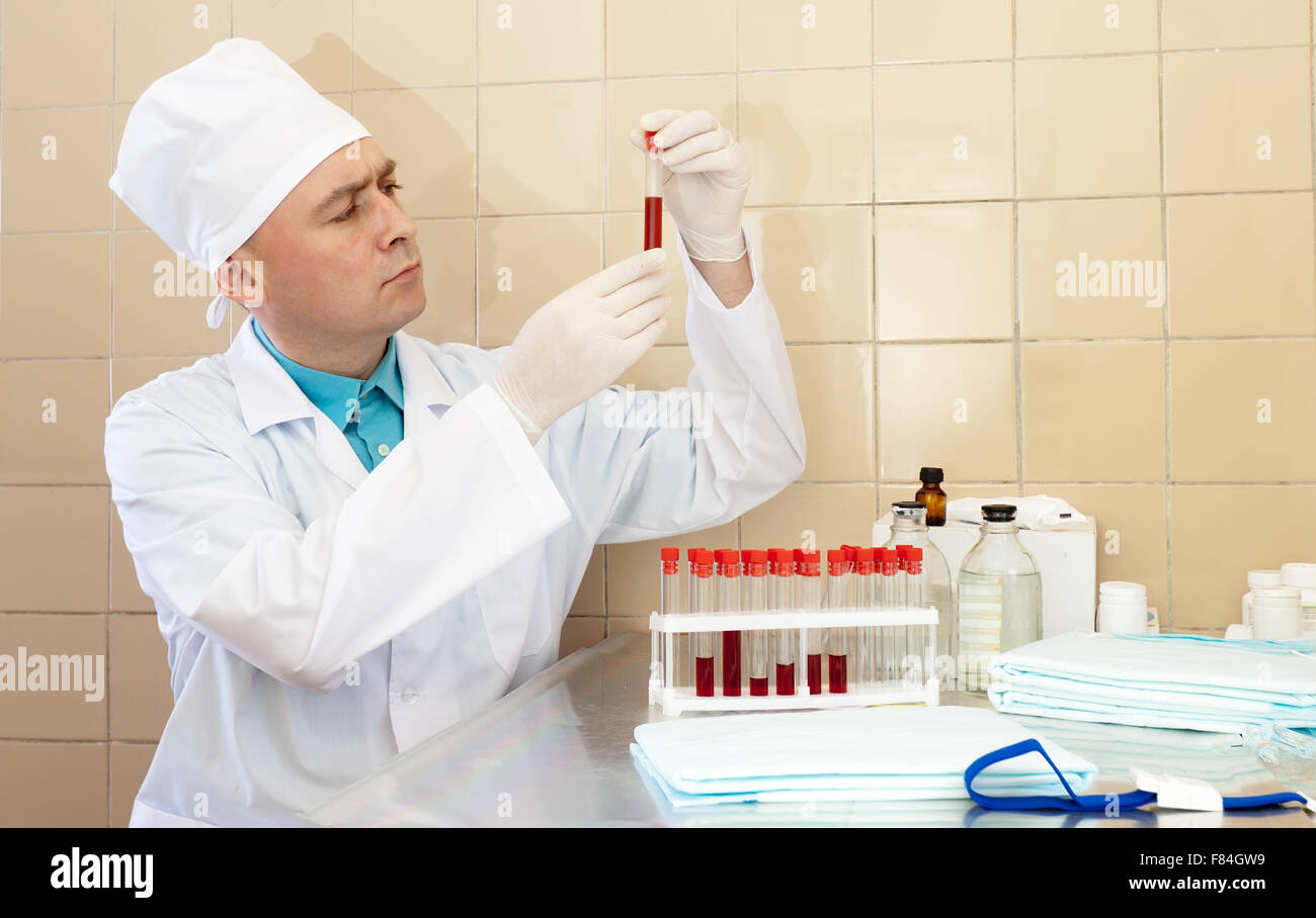y male nurse works with blood sample in medical laboratory Stock Photo ...