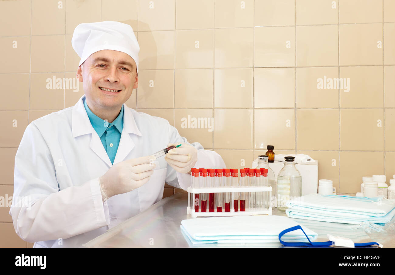 male nurse works with blood sample in medical laboratory Stock Photo ...