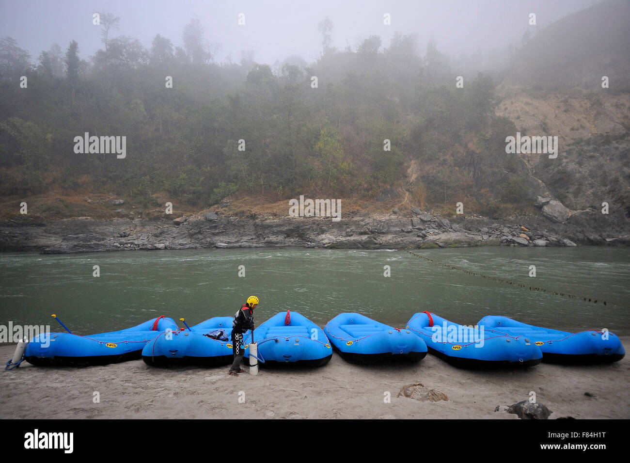 Kathmandu, Nepal. 05th Dec, 2015. A rafting guide filling air inside ...