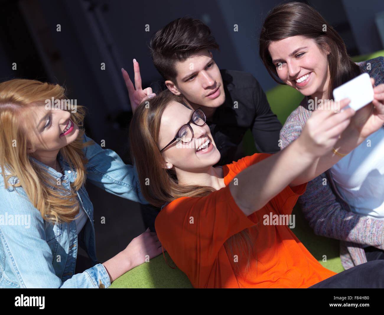 happy students group taking selfie with smartphone and tablet computer ...