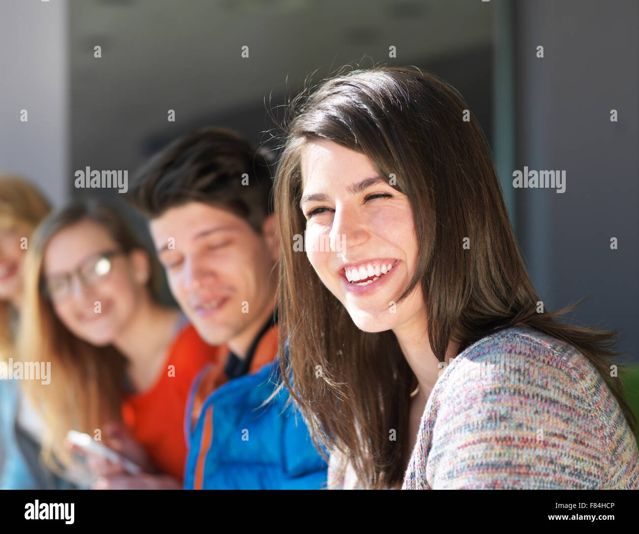 students group working on school project together on tablet computer at ...