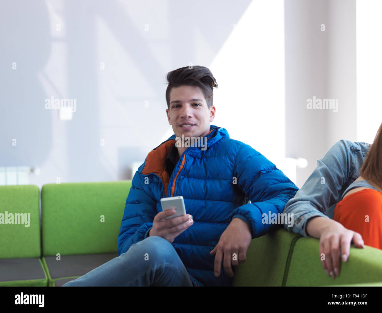 student using smartphone at university school modern interior Stock ...
