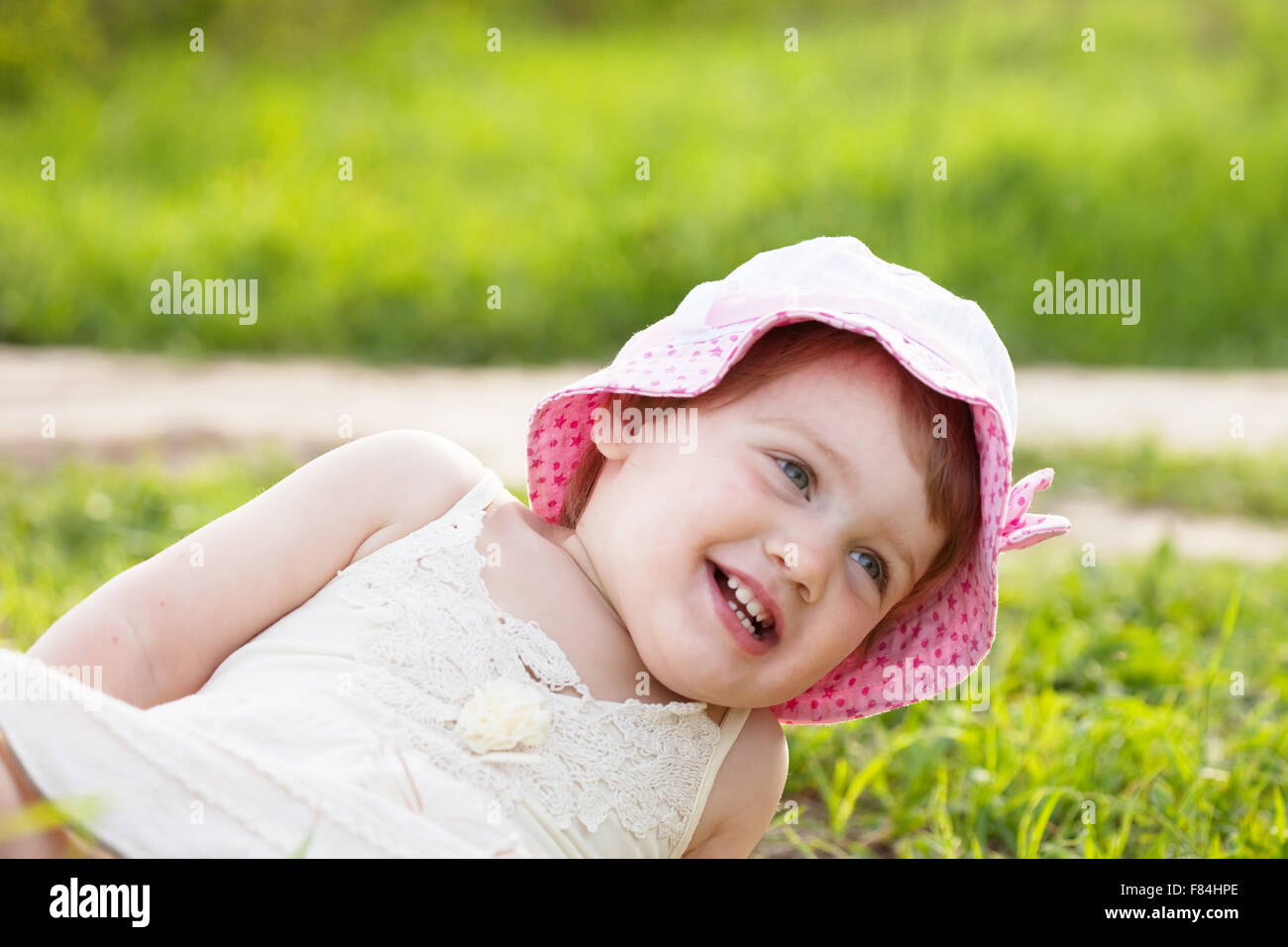 Two-year baby girl in summer meadow Stock Photo - Alamy