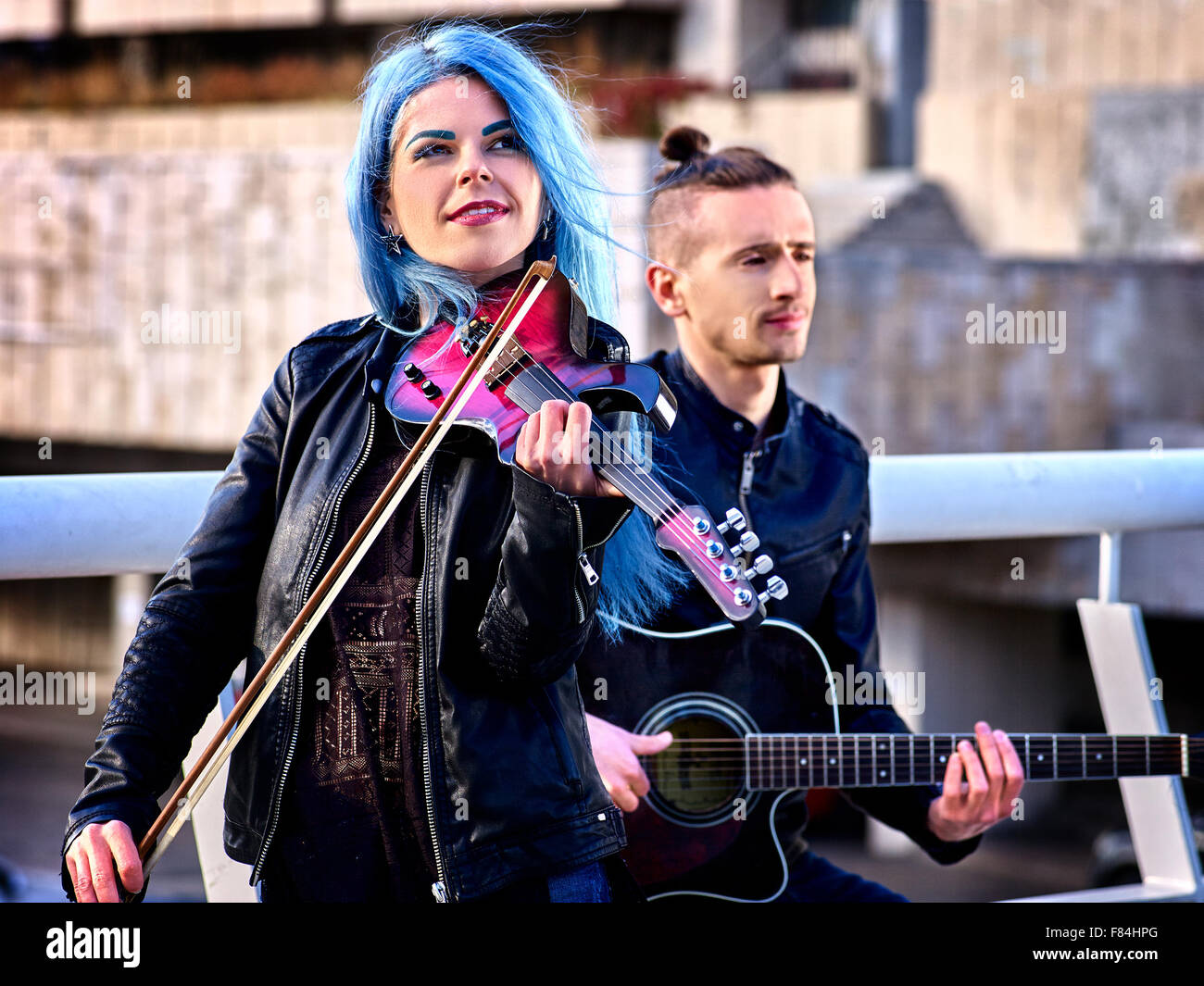 Music street performers with girl violinist Stock Photo - Alamy