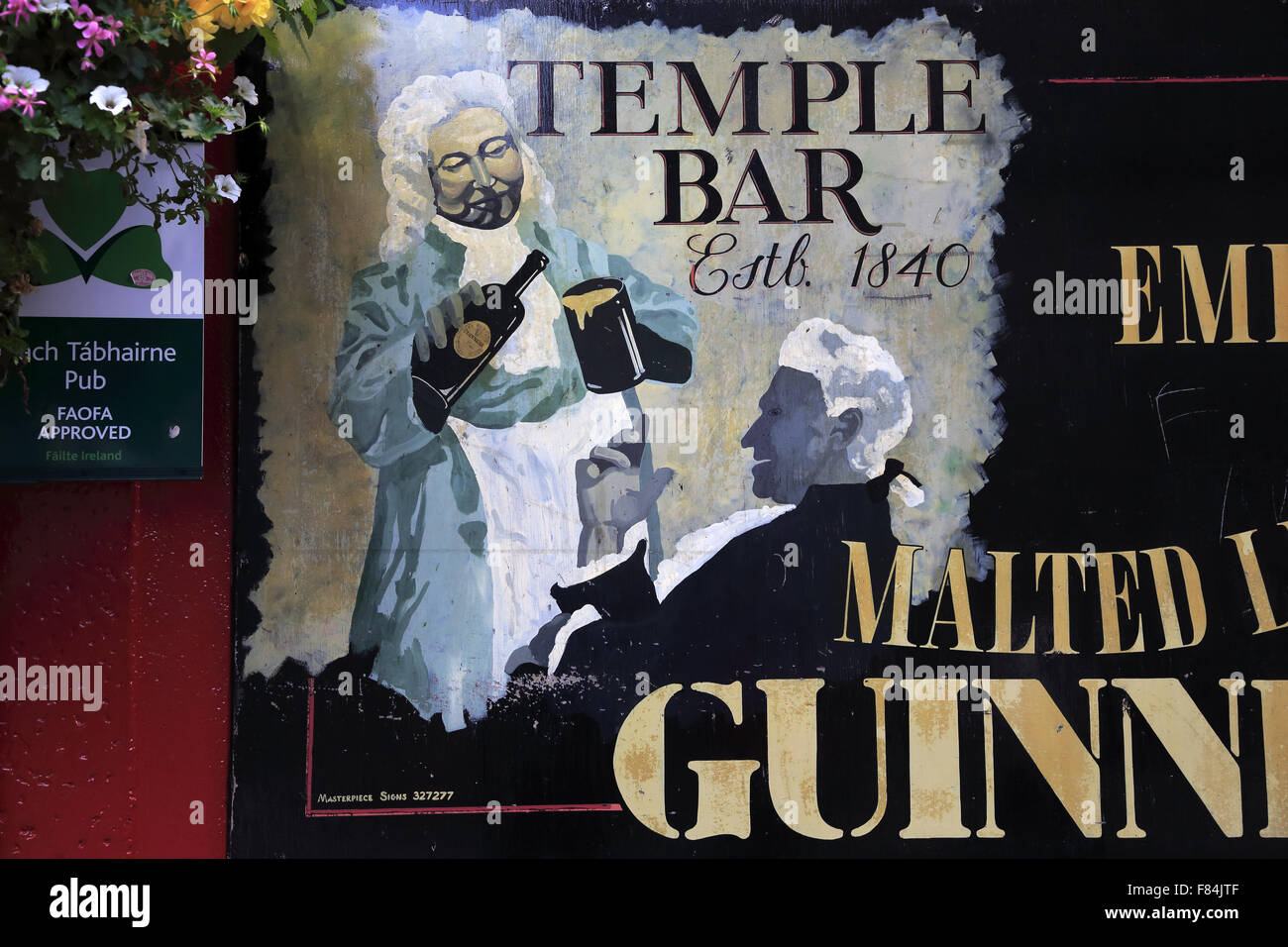 Guinness beer advertising on the wall of Temple Bar pub in Temple Bar ...