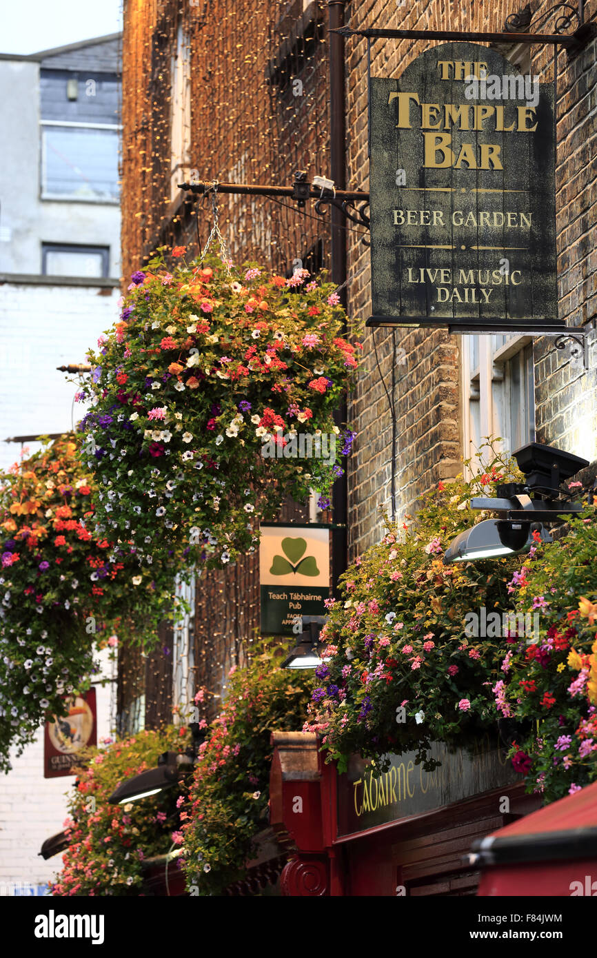 The sign of Temple Bar pub and flowers decorated the exterior of pub in ...