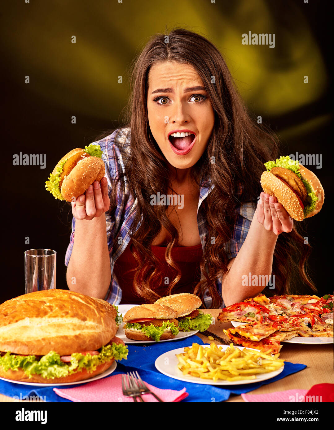 Girl eating big sandwich Stock Photo - Alamy