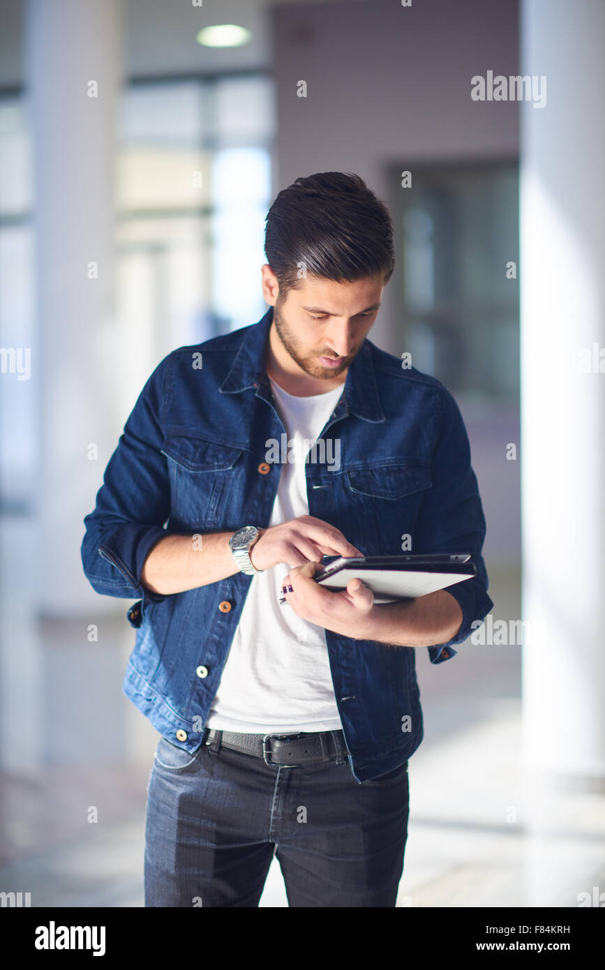 student using tablet computer for education in school, university ...