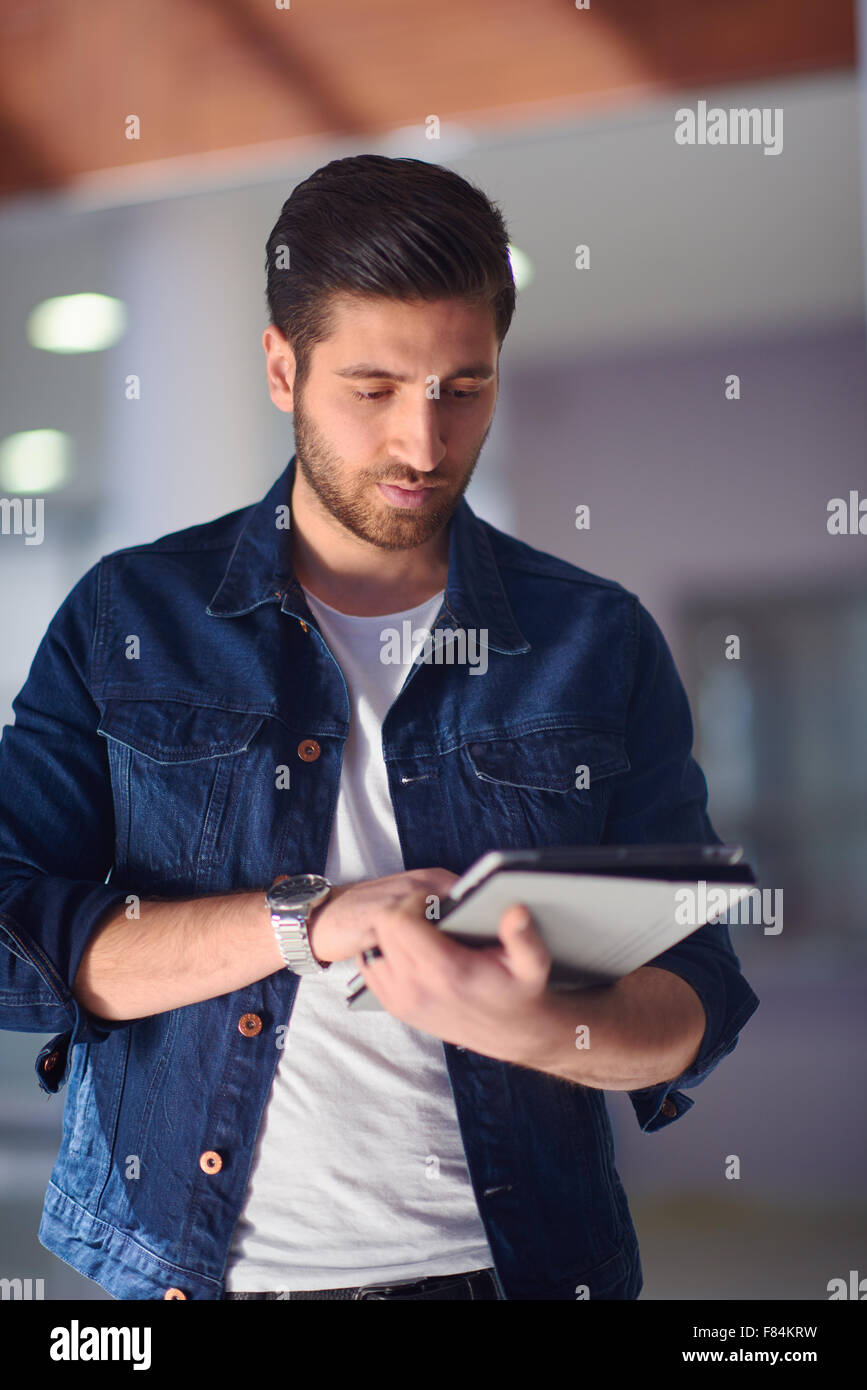 student using tablet computer for education in school, university ...