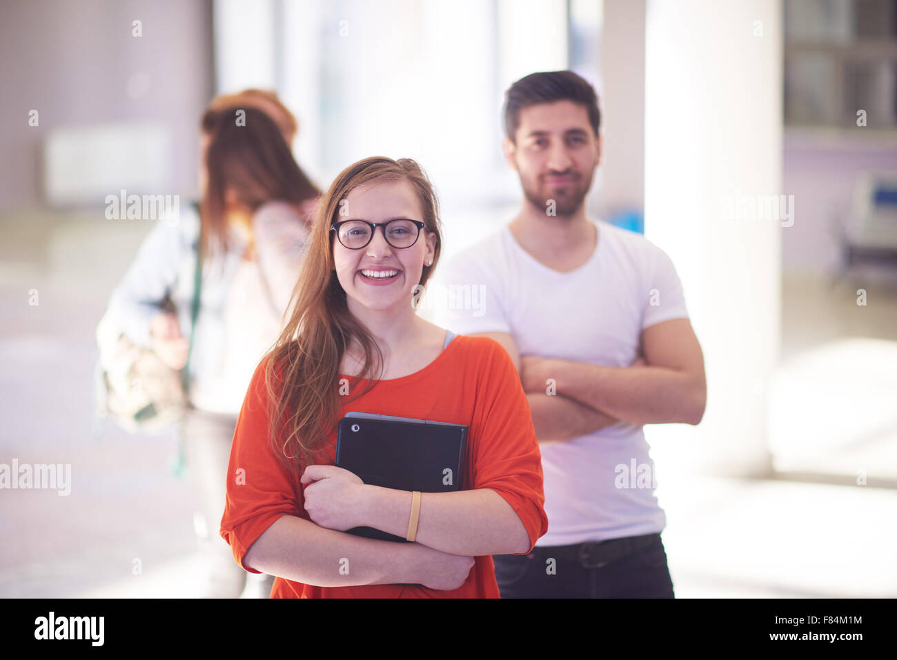 happy students couple standing together at university campus interior ...