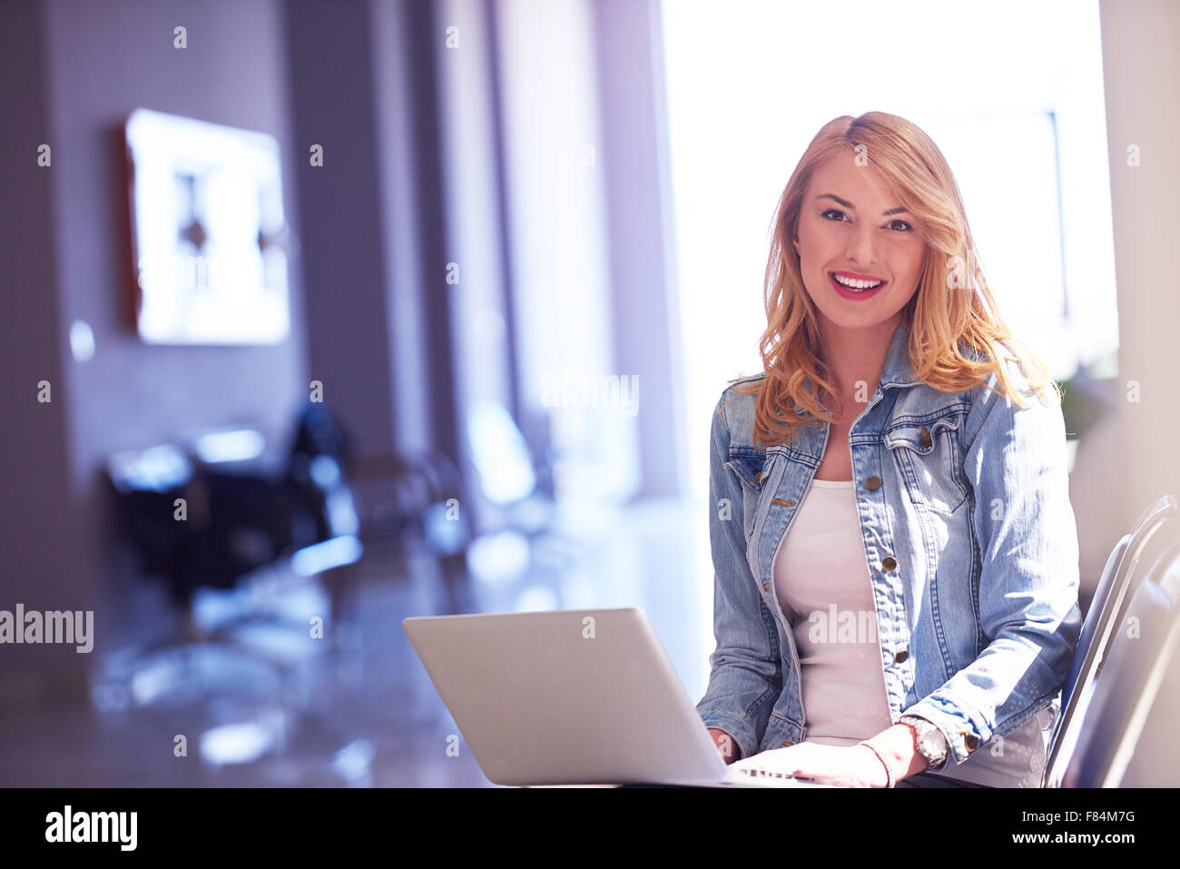 happy student girl working on laptop computer at modern school ...