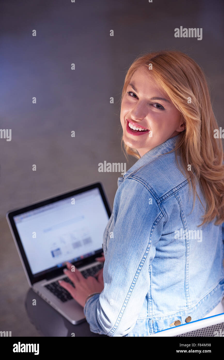 happy student girl working on laptop computer at modern school ...