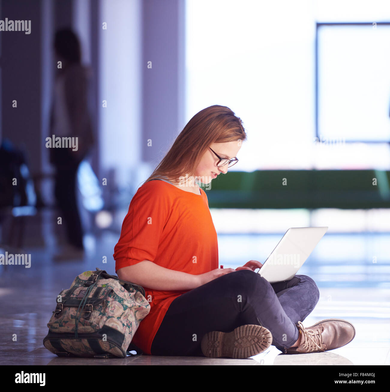happy student girl working on laptop computer at modern school ...