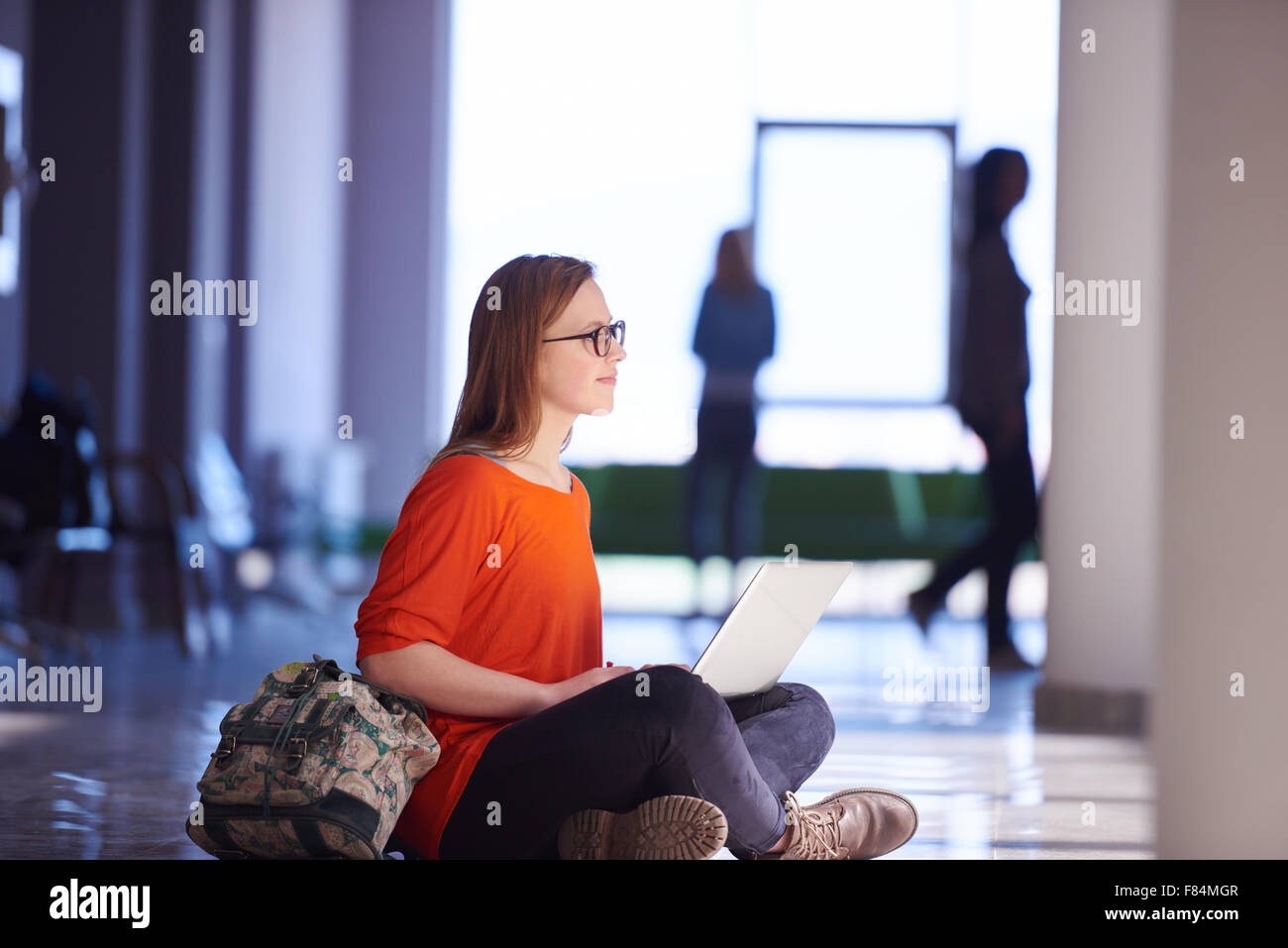 happy student girl working on laptop computer at modern school ...