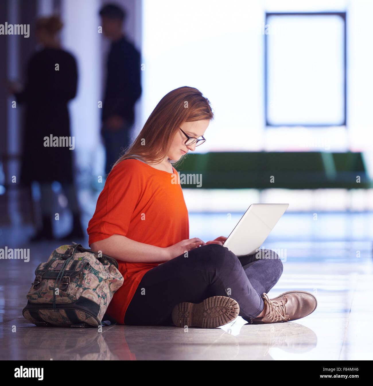 happy student girl working on laptop computer at modern school ...
