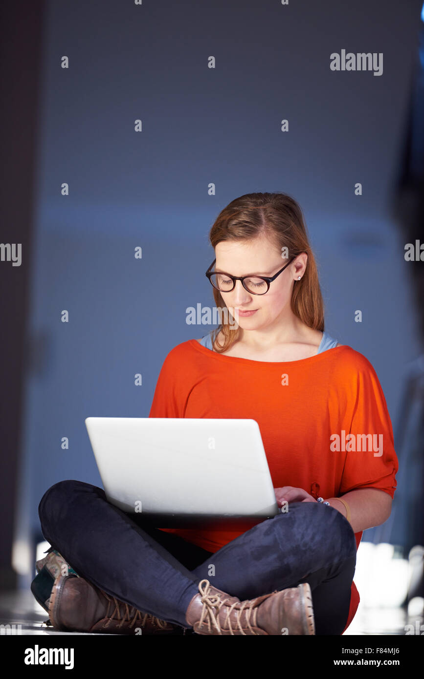 happy student girl working on laptop computer at modern school ...