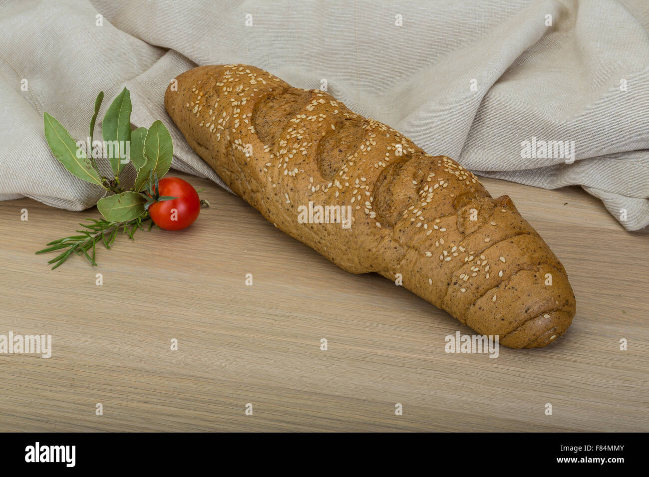 Cereal loaf with tomato and laurel leaves Stock Photo - Alamy