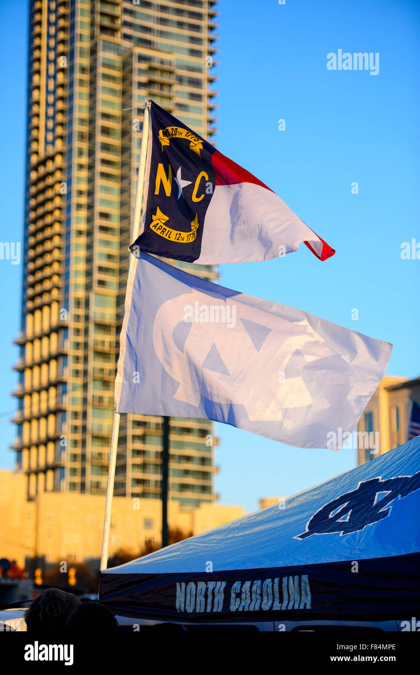 The UNC and North Carolina State flag fly high above the cars while ...