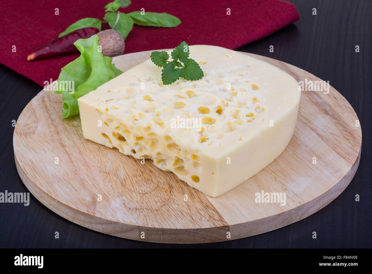 Yellow cheese - maasdam with salad leaves Stock Photo - Alamy