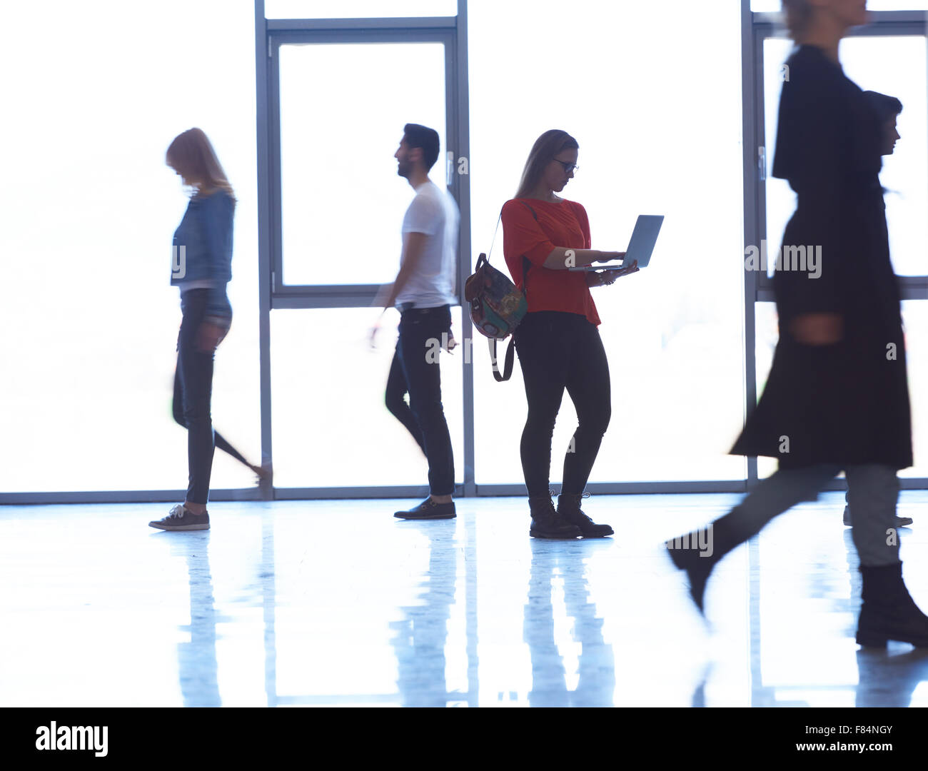 happy student girl working on laptop computer at modern school ...