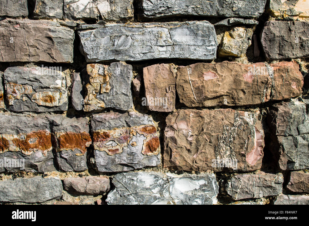 Medieval stone wall for background in Italy Stock Photo - Alamy