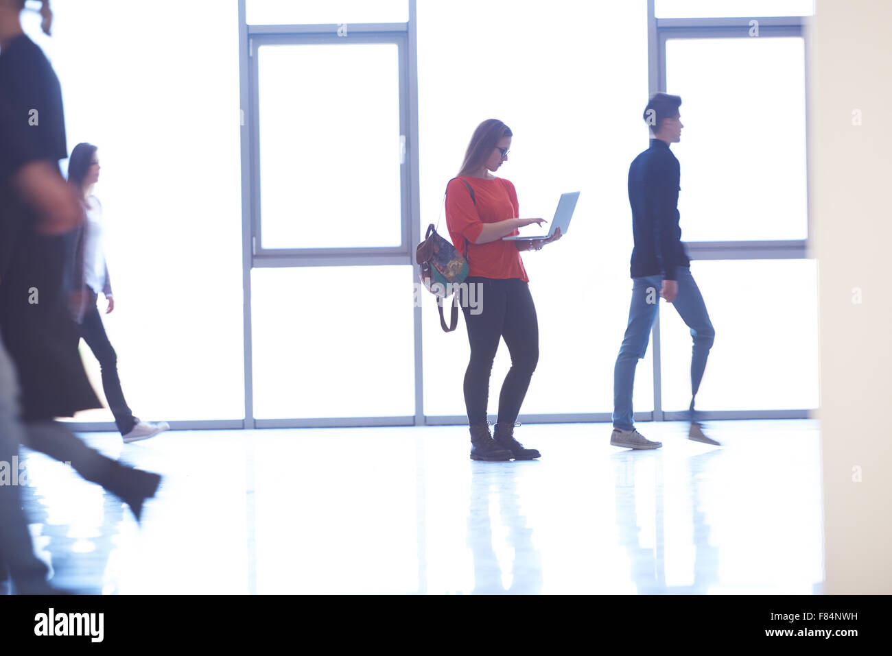 happy student girl working on laptop computer at modern school ...