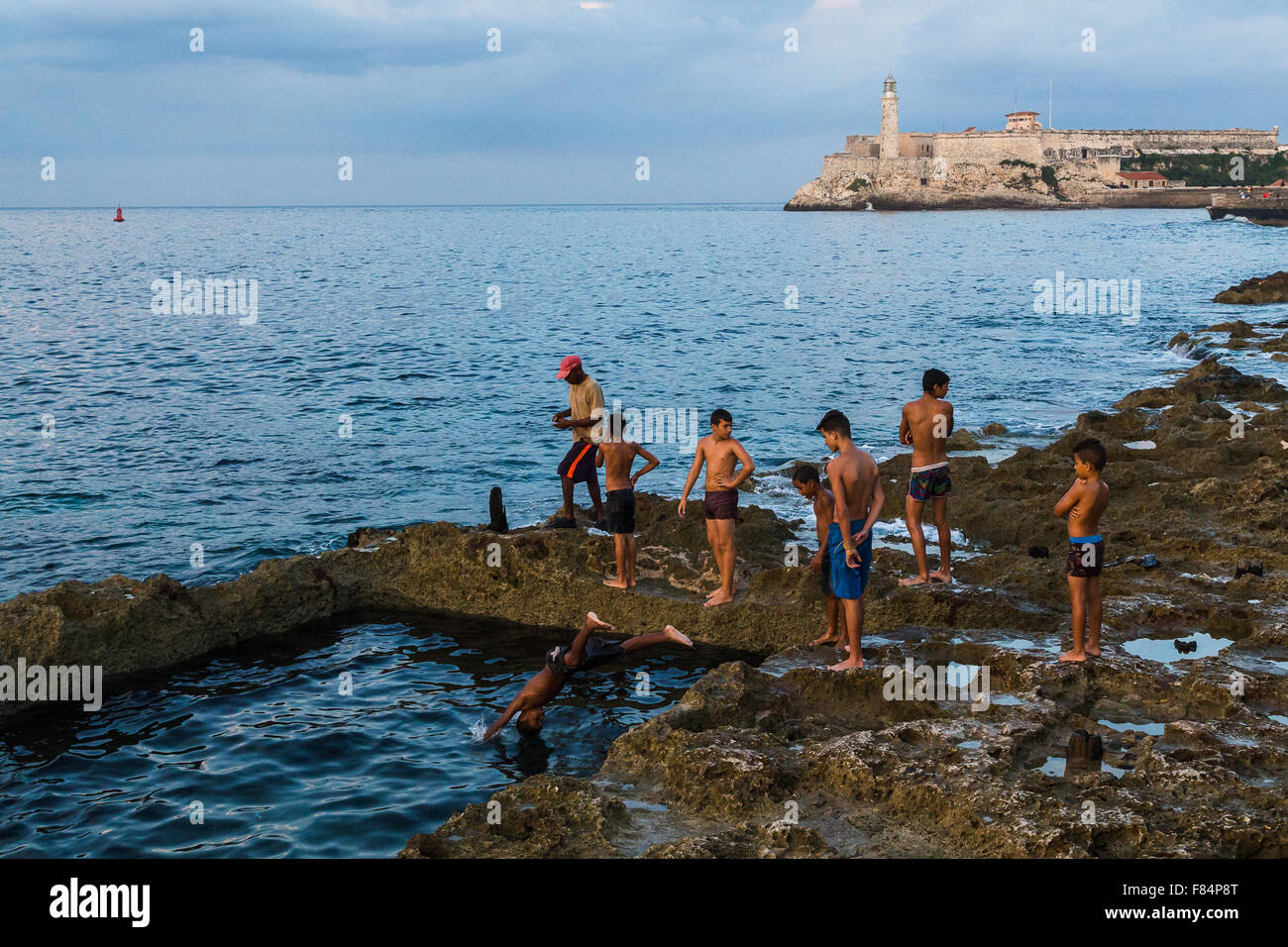 Boys cooling off in the sea Stock Photo - Alamy