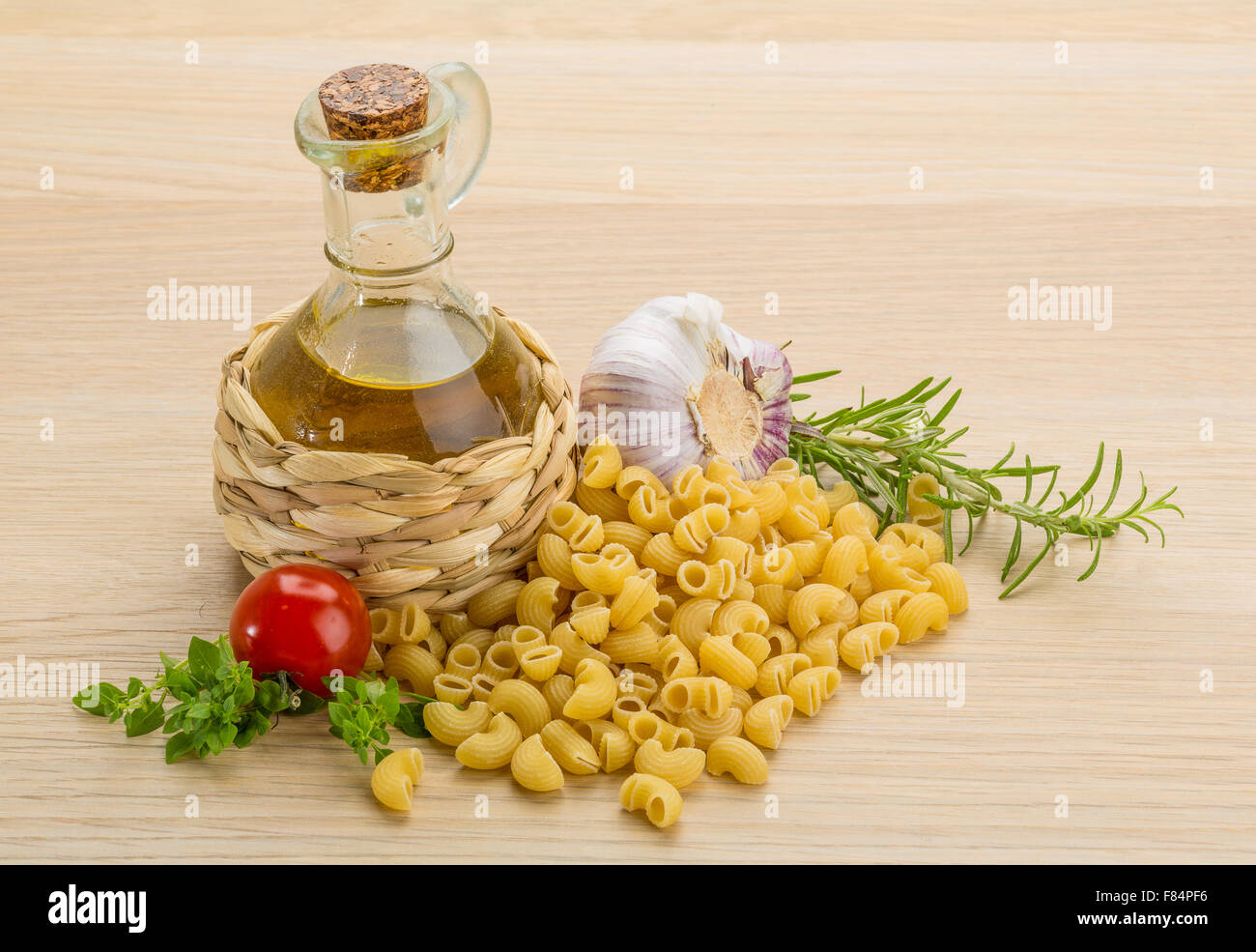 Raw italian pasta with herbs Stock Photo - Alamy