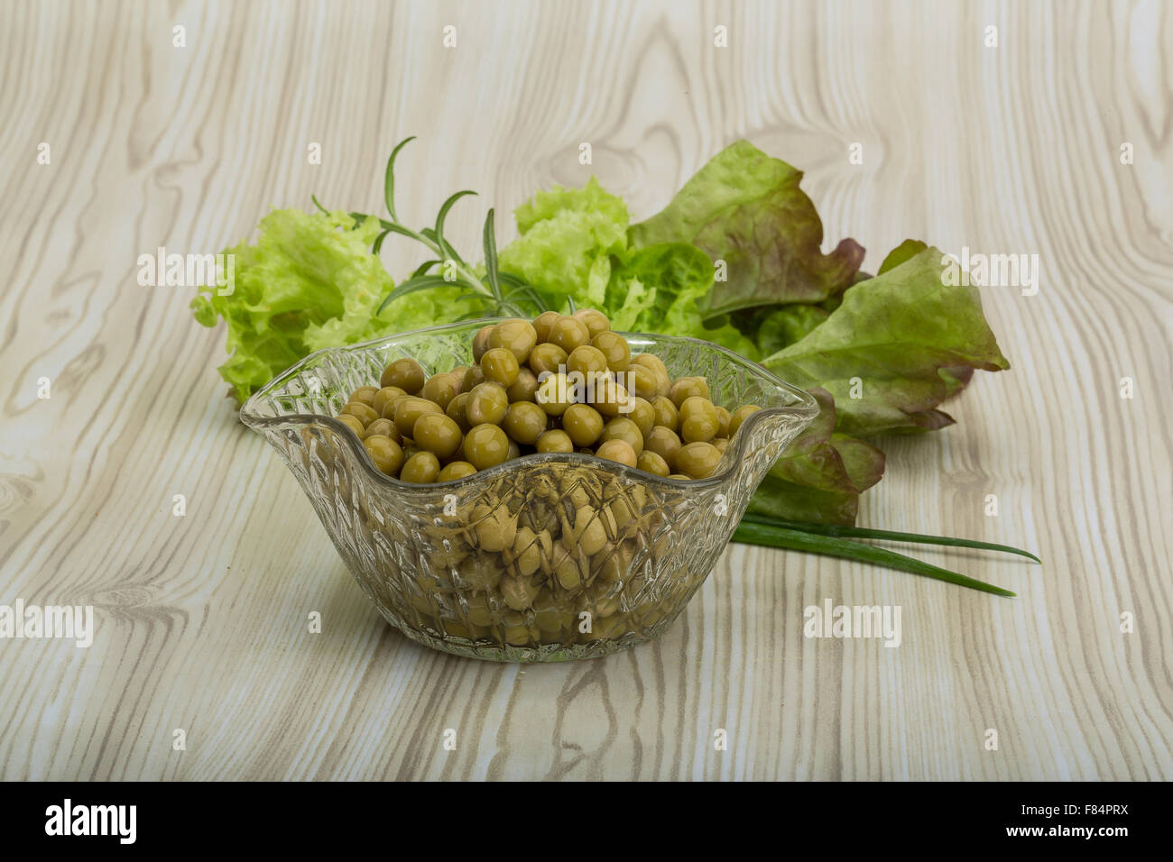 Marinated peas - in the bowl with salad leaves Stock Photo - Alamy