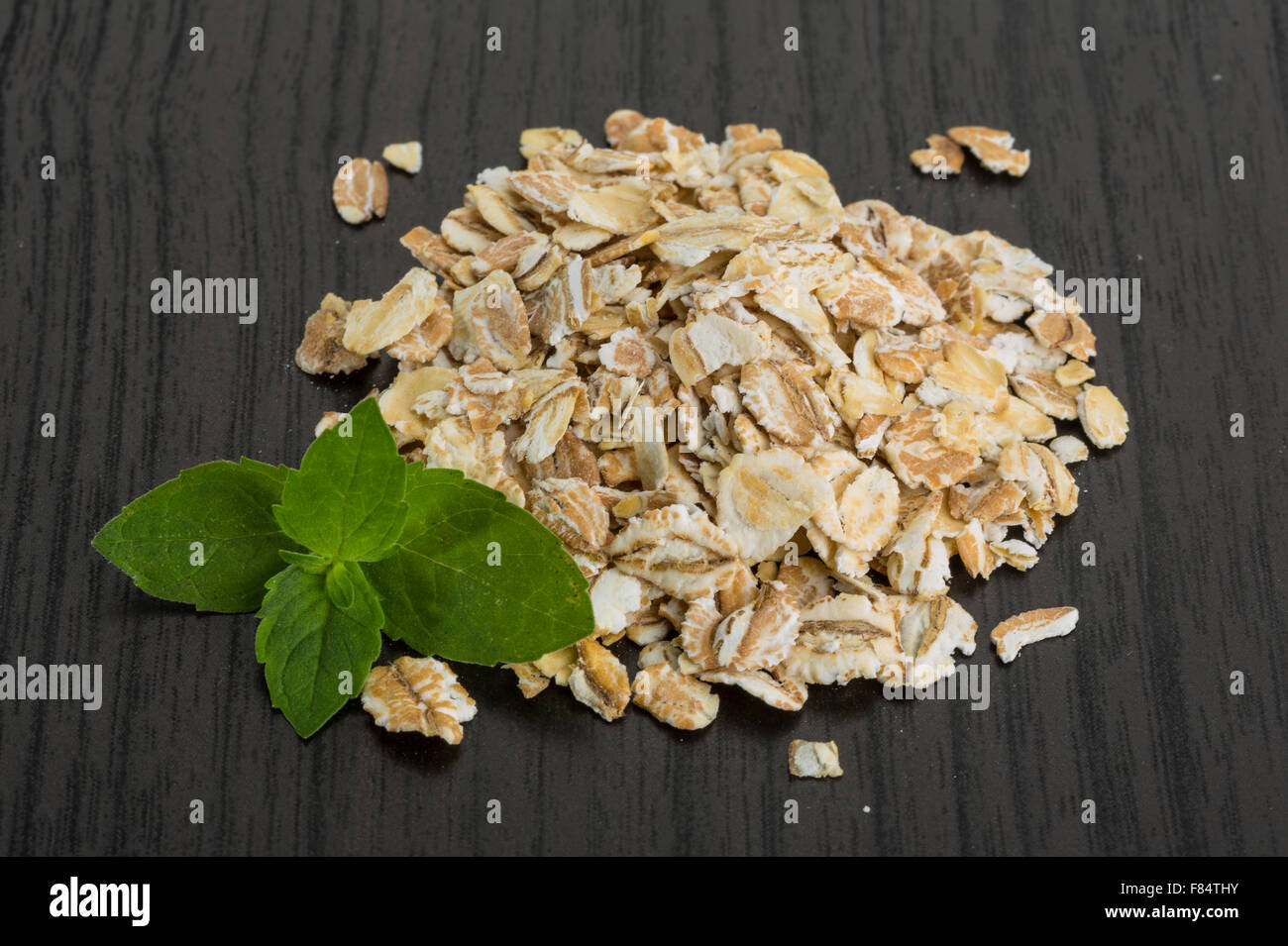 Raw oats on the board Stock Photo - Alamy