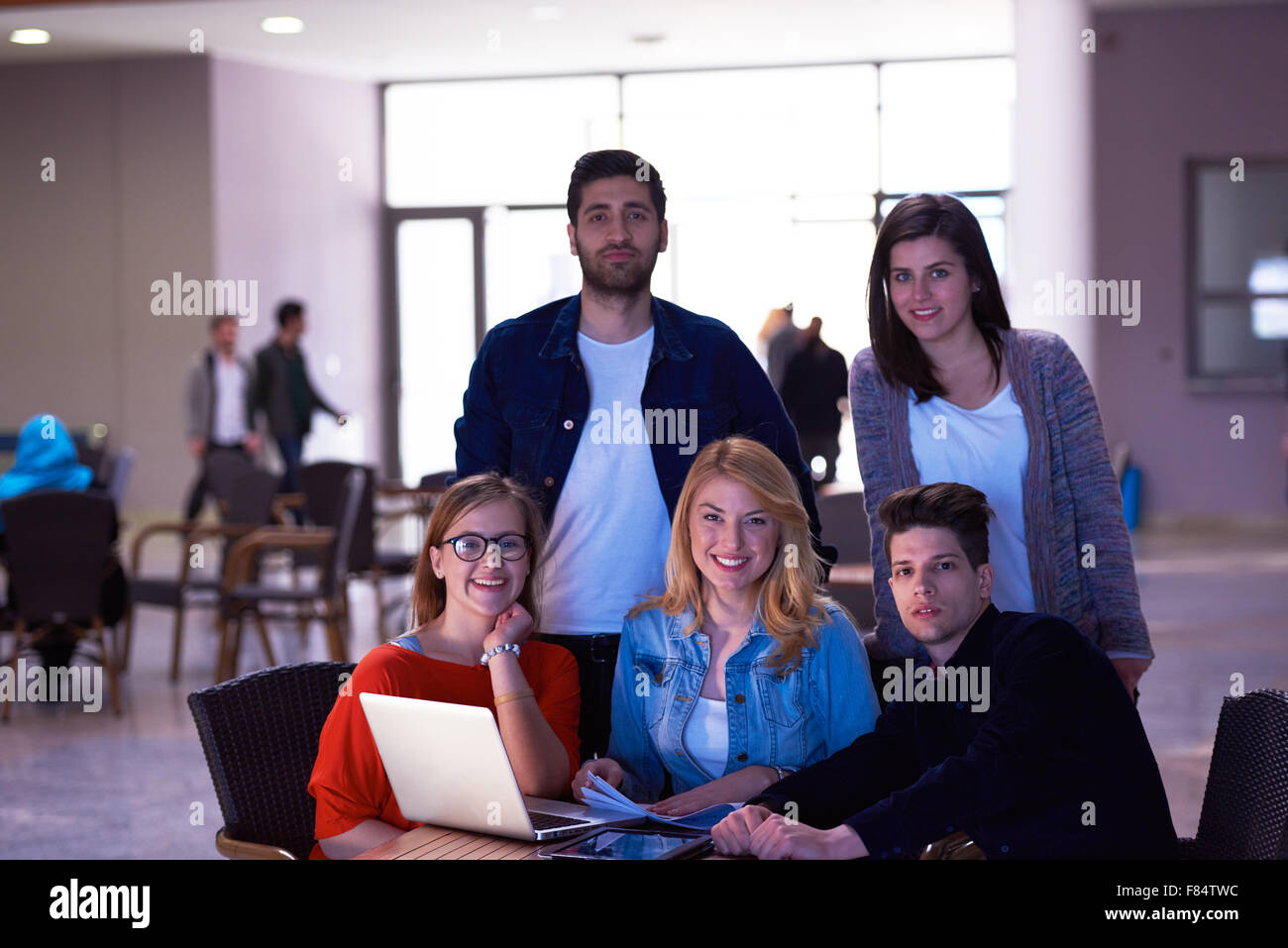 students group standing together as team in modern school university ...