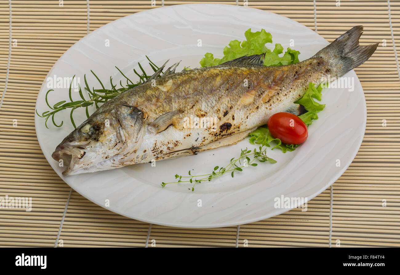 Grilled seabass fish - with rosemary and thyme Stock Photo - Alamy
