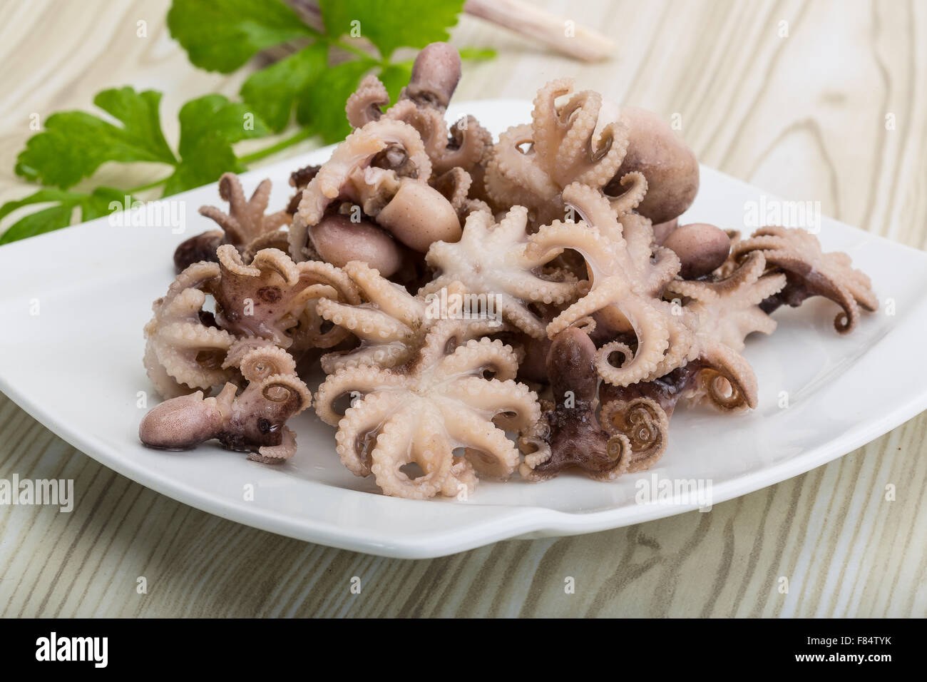 Boiled octopus - mini seafood in the bowl Stock Photo - Alamy