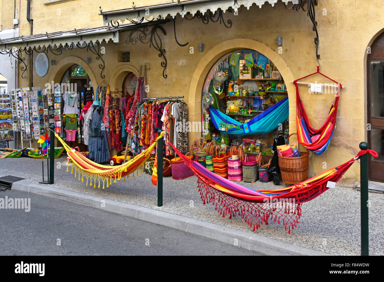 Lourmarin village street shop front pavement display of touristy summer ...